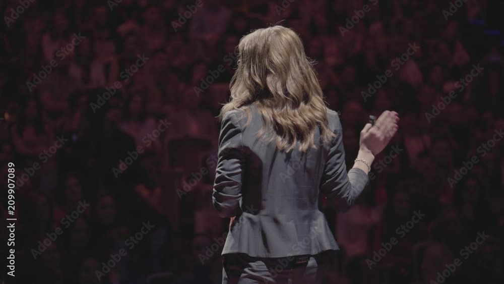 Expert perform on the stage address to modern crowd audience sitting ...