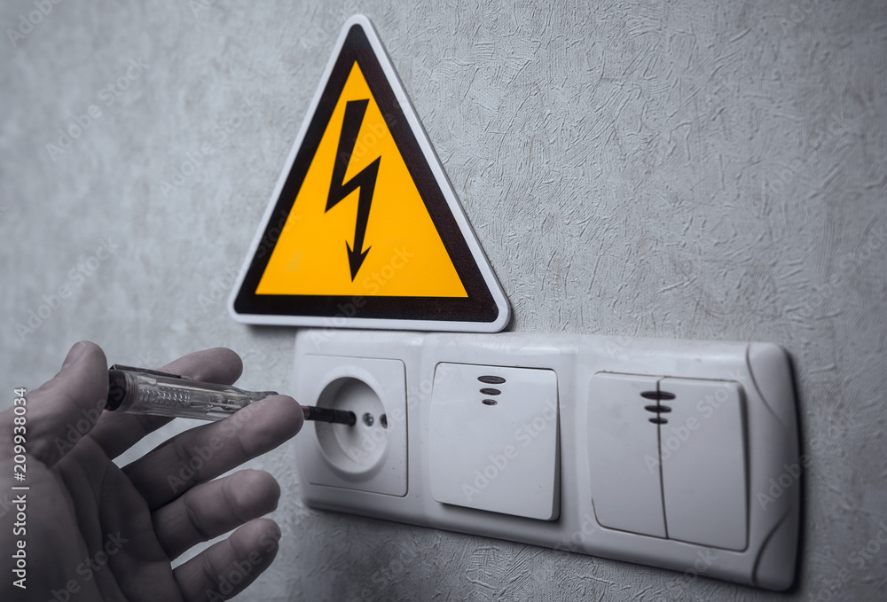 Electrician makes electrical measurements; jumps tension, electrical ...