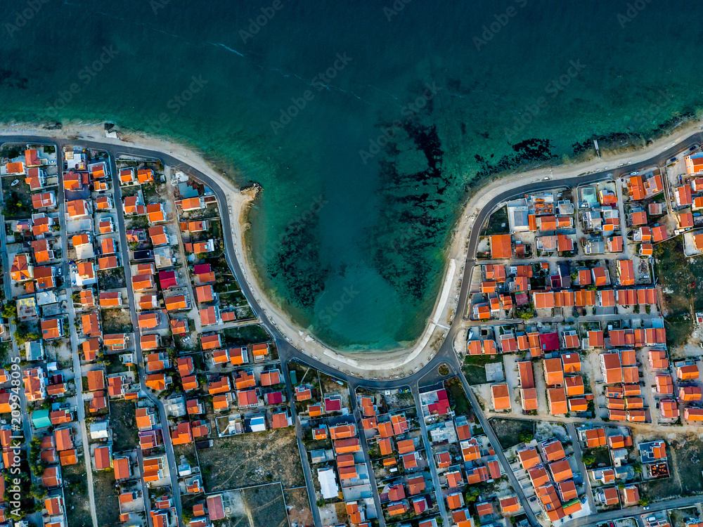 Island Vir bay with houes apartments aerial top down shot with drone ...