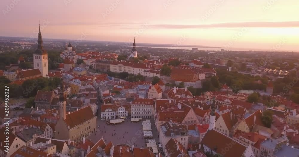 Beautiful aerial purple sunset view of the Tallinn old town from above ...