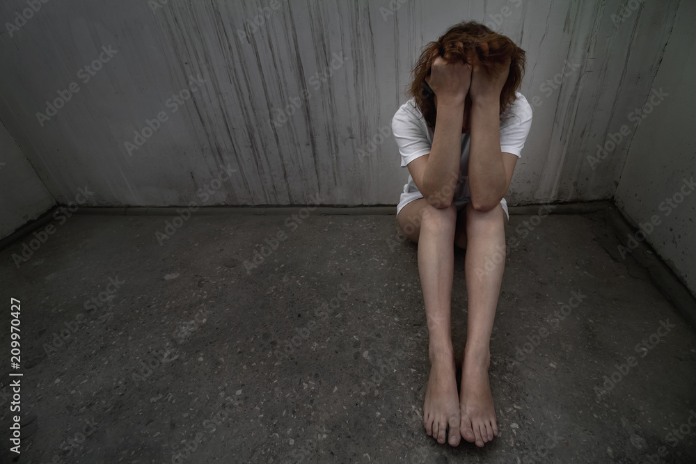 Sad Woman Sitting Alone On The Floor In An Empty Room Woman In T Shirt