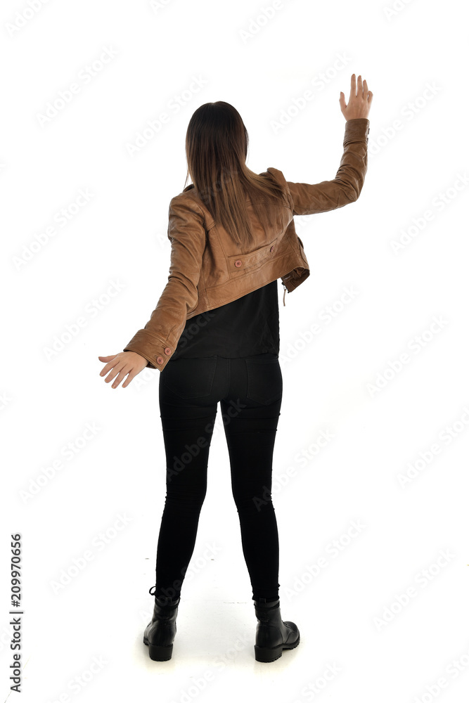 full length portrait of brunette girl wearing brown leather jacket ...