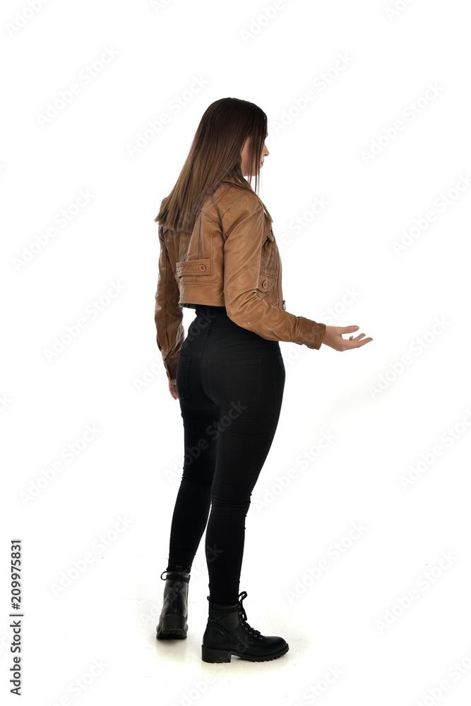 full length portrait of brunette girl wearing brown leather jacket ...