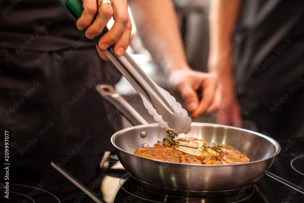 oncept of the correct cooking of meat. The chef prepares, fries a steak ...