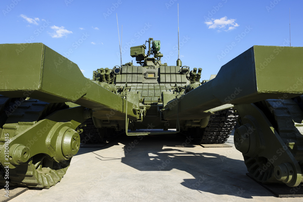 Demining military vehicle, armored mine clearing tank of green color ...