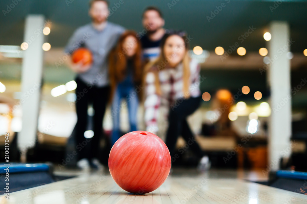 Friends bowling at club Stock Photo | Adobe Stock