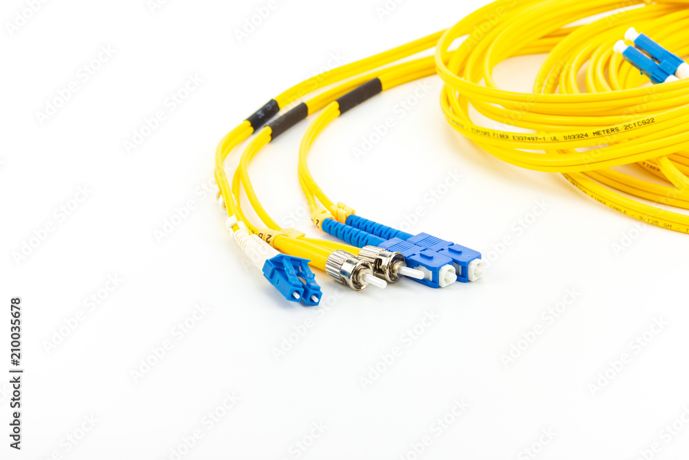 Single mode fiber optic cables patch cord with LC, SC and ST connector type on white background ...