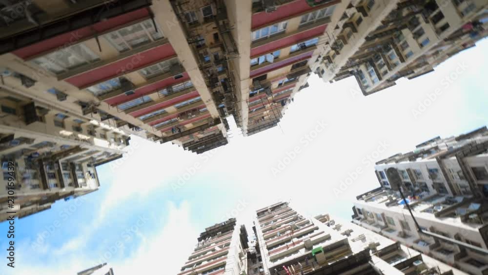 Low angle view of crowded residential towers in an old community in ...