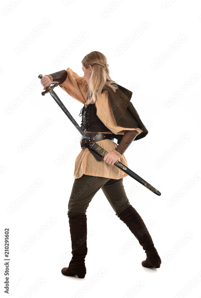 full length portrait of girl wearing medieval costume with sword ...
