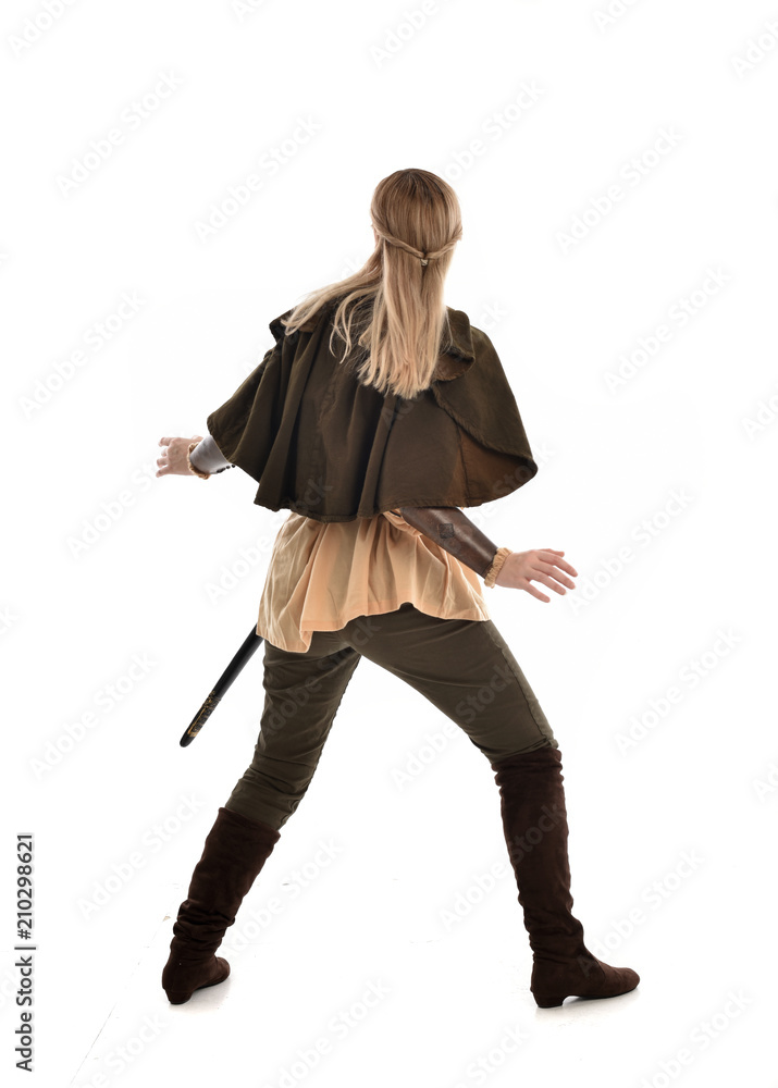full length portrait of girl wearing medieval costume with sword ...
