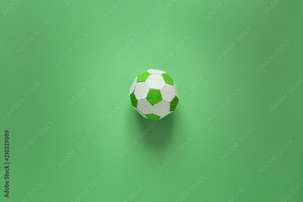 Paper soccer ball on soccer field or green background. Origami. Paper ...