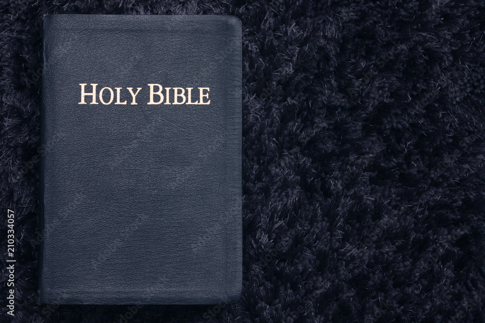 Holy Bible on Dark Texture Stock Photo | Adobe Stock