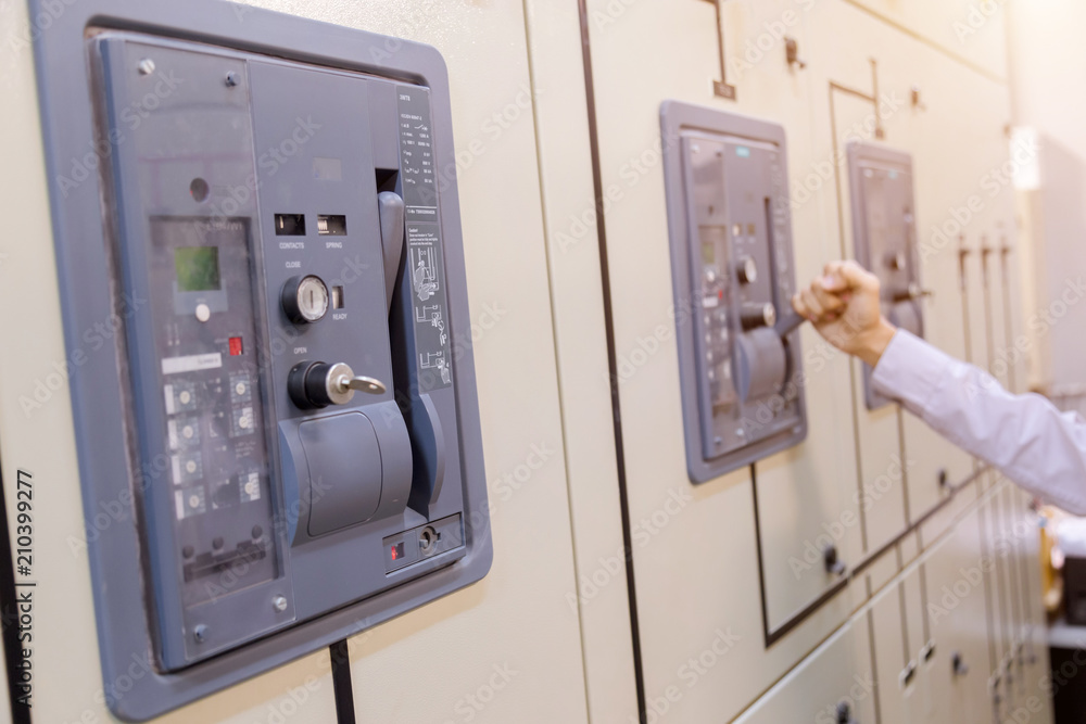 Engineer is check voltage or current by voltmeter in control panel of ...