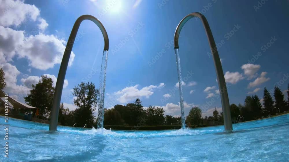 Vidéo Stock Waterfalls Pool Fountain. Blue sunny waterfall fountain in ...