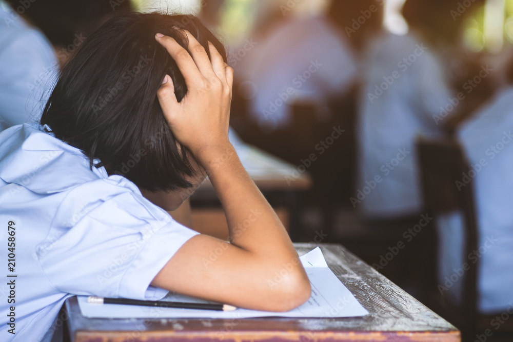 Students taking exam with stress in school classroom. Stock Photo ...
