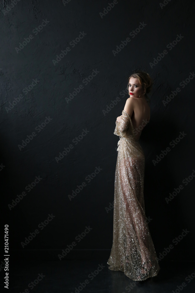 Sexy blonde in transparent dress with golden rhinestones Stock Photo ...