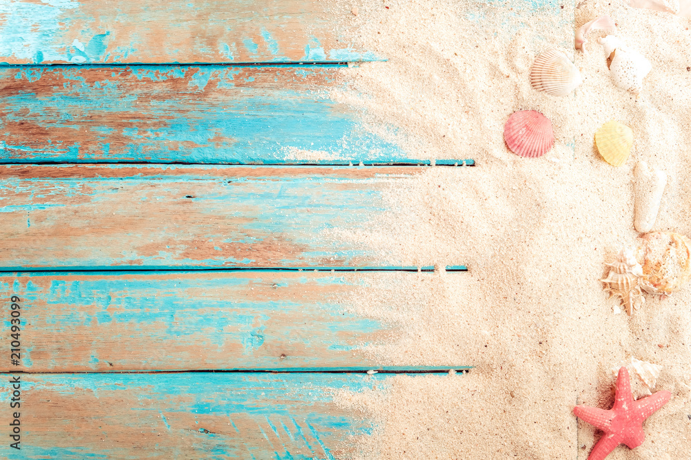 Beach background - top view of beach sand with shells, starfish on wood ...