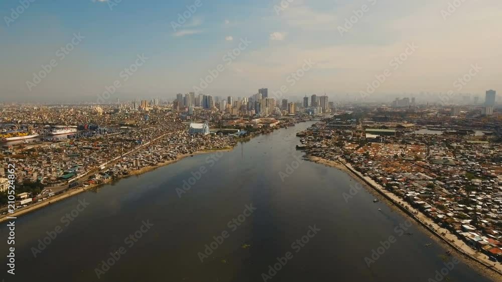 Aerial view skyline of Manila city. Fly over city with skyscrapers and ...