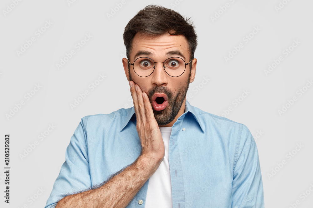 Shocked amazed Caucasian male becomes victim of swindler, reacts on ...