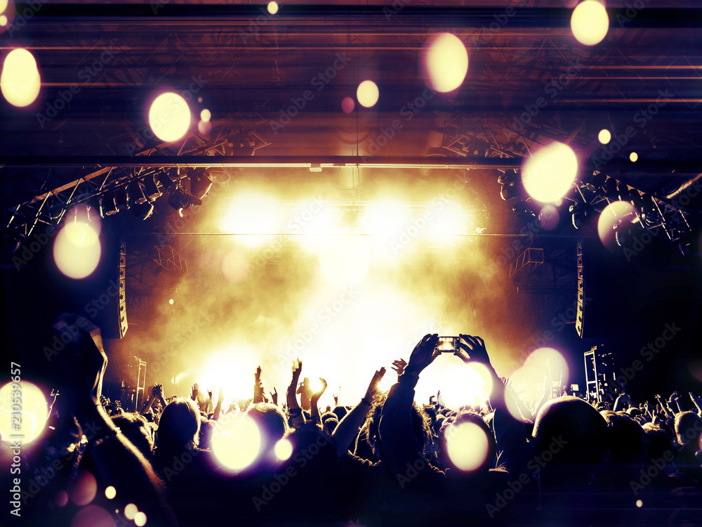 Concert crowd covered in giltter falling from above. Stock Photo ...