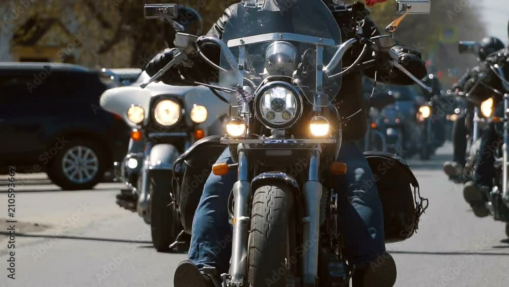 many subculture bikers group ride on the track on a Sunny summer day on ...