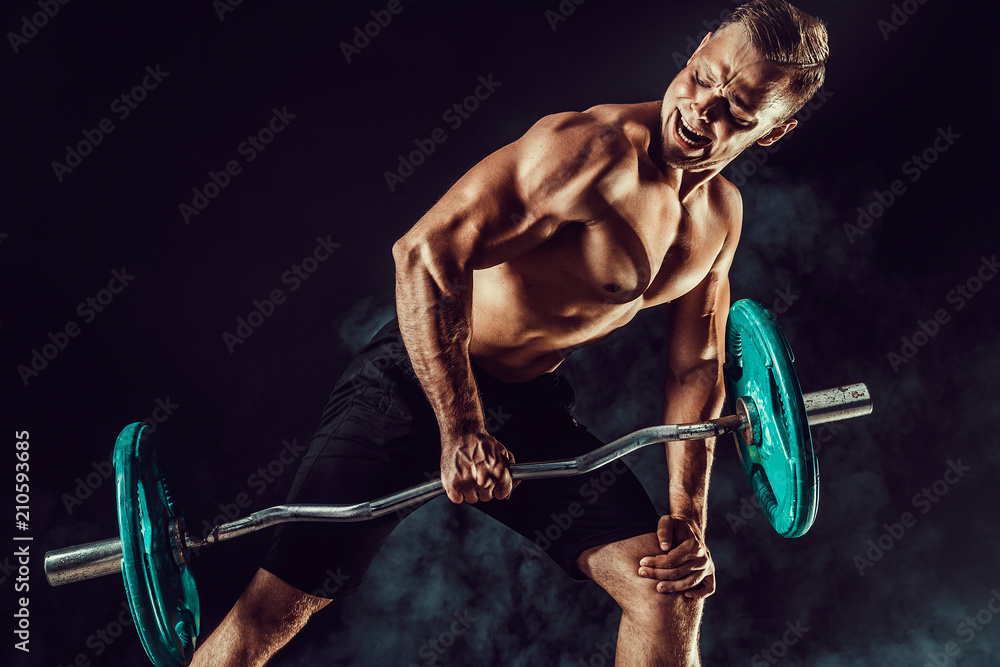 Strong athletic man pumping up muscles workout bodybuilding. muscular ...