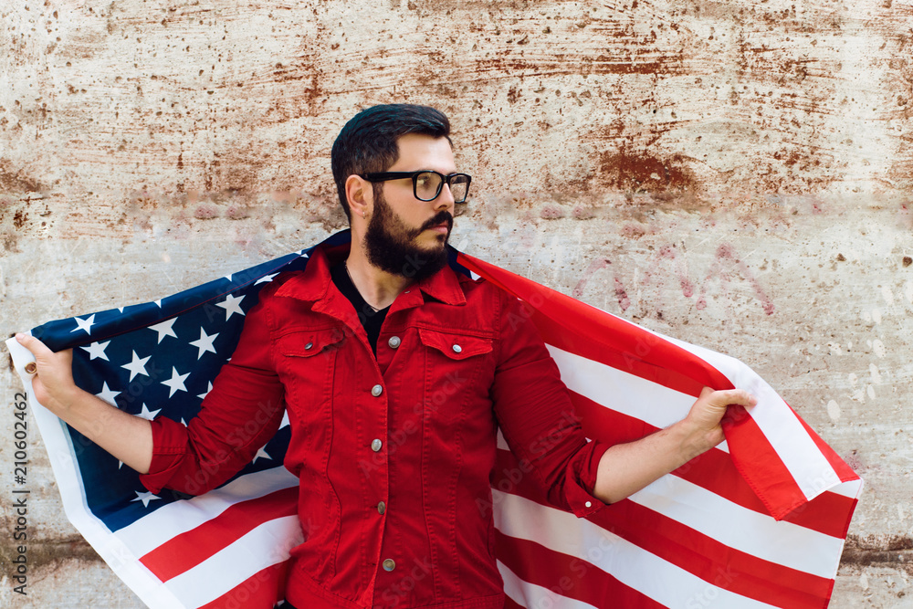 Happy 4Th Of July card. man is holding waving american USA flag, toned ...