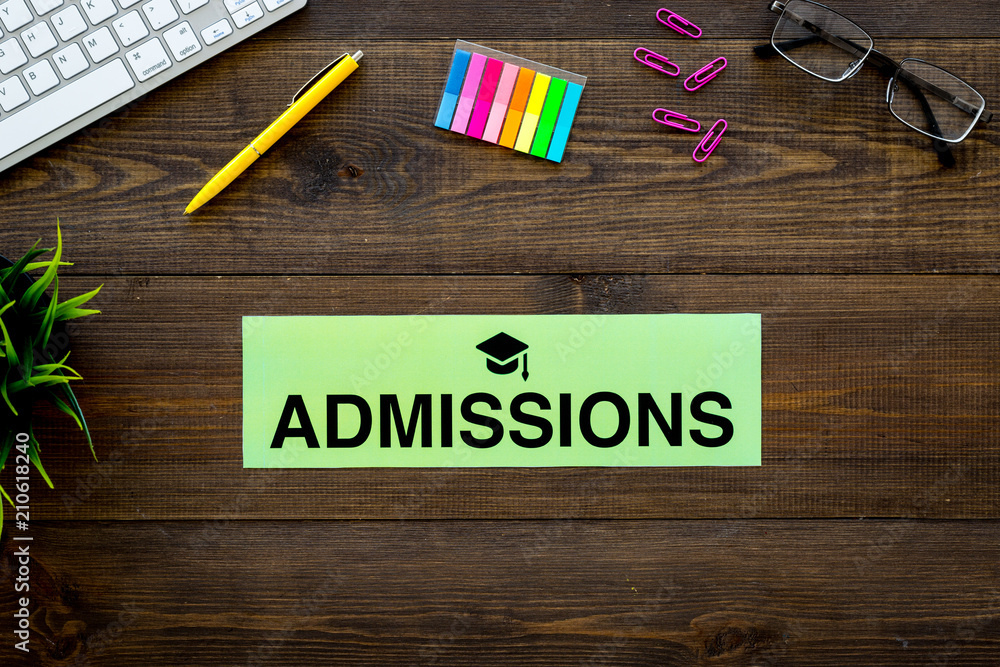 College admission concept. Word admissions with graduation cap sign on ...