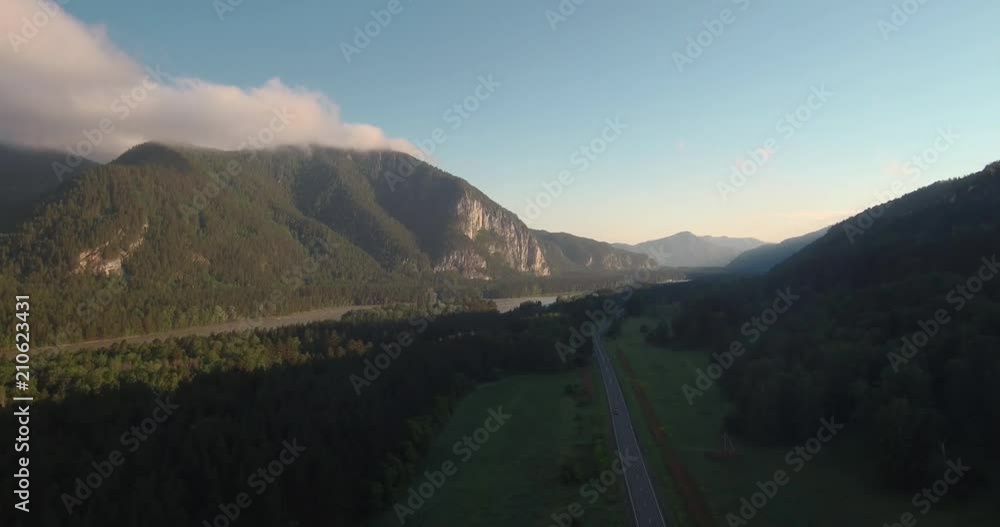 Aerial view of highway with mountain landscape. morning mist over the ...