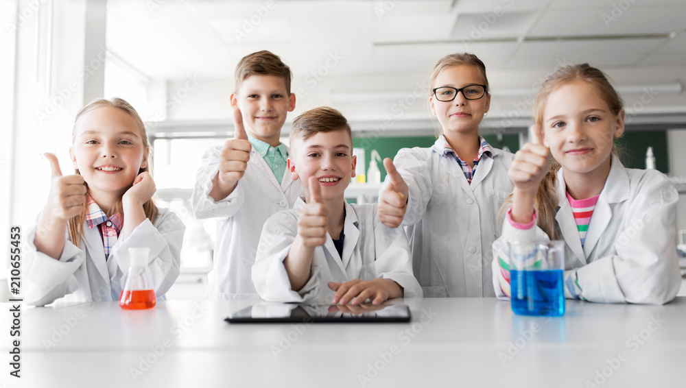 education, science and technology concept - happy kids with tablet pc ...