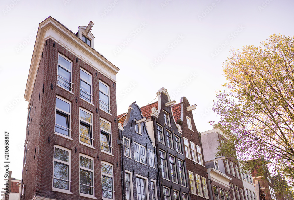 Old dutch buildings of Amsterdam city with big opened windows. Stock ...