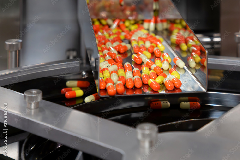 pharmacy medicine capsule pill in production line at medical factory ...