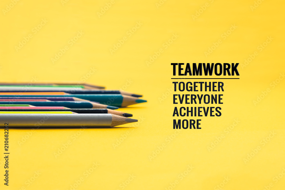 Teamwork concept. group of color pencil on yellow background with word ...