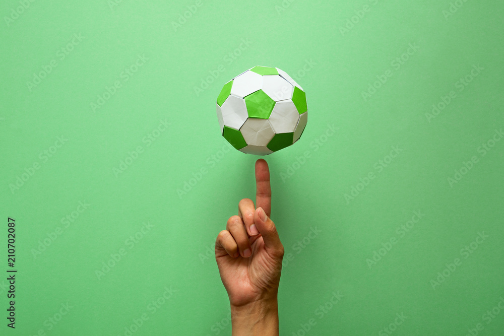 Paper soccer ball on soccer field or green background. Origami. Paper ...