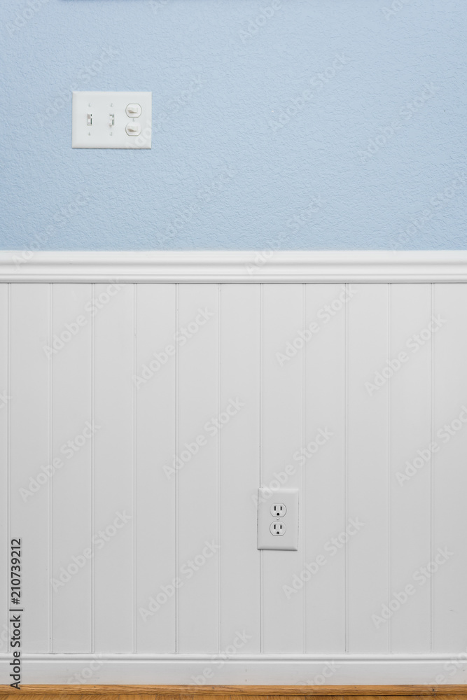 White beadboard or wainscoting with light blue wall paint Stock Photo ...