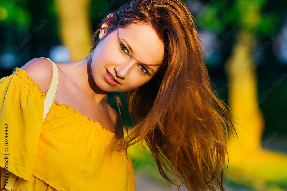 passionate look of a young girl in seductive clothes that looks in the ...