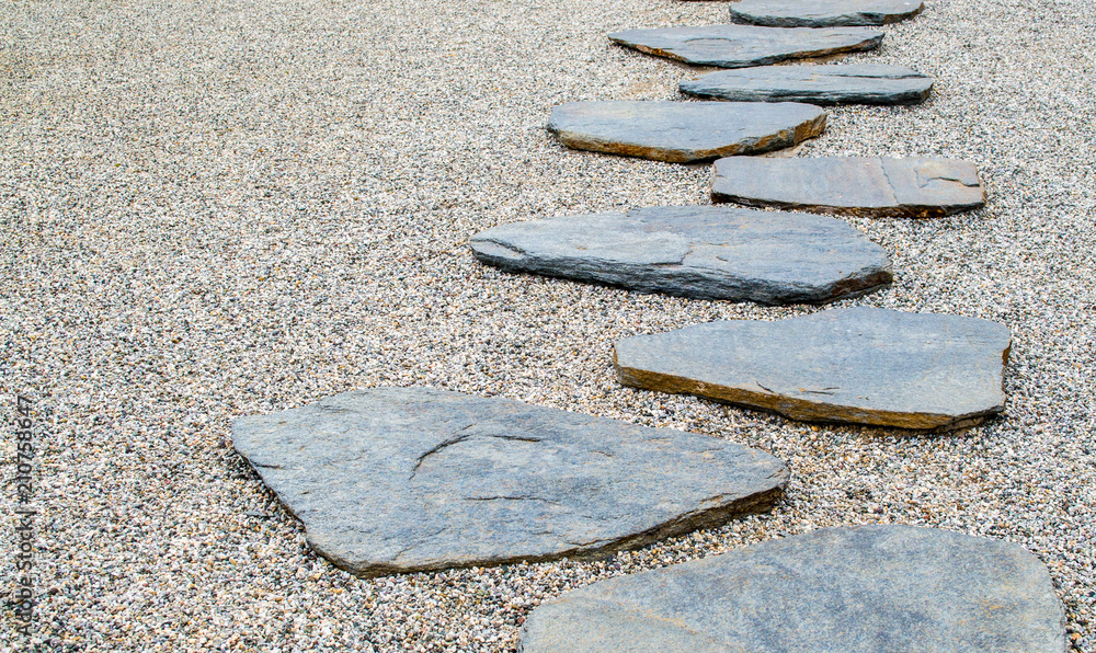 simple stone path in smooth gravel with copy space at a Japanese garden ...
