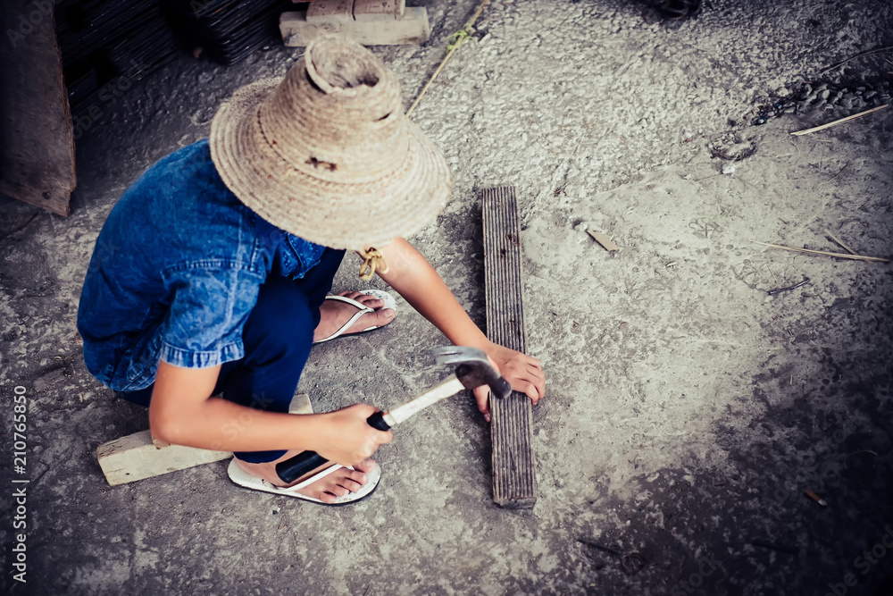 Little girl labor working in commercial building structure, World Day ...