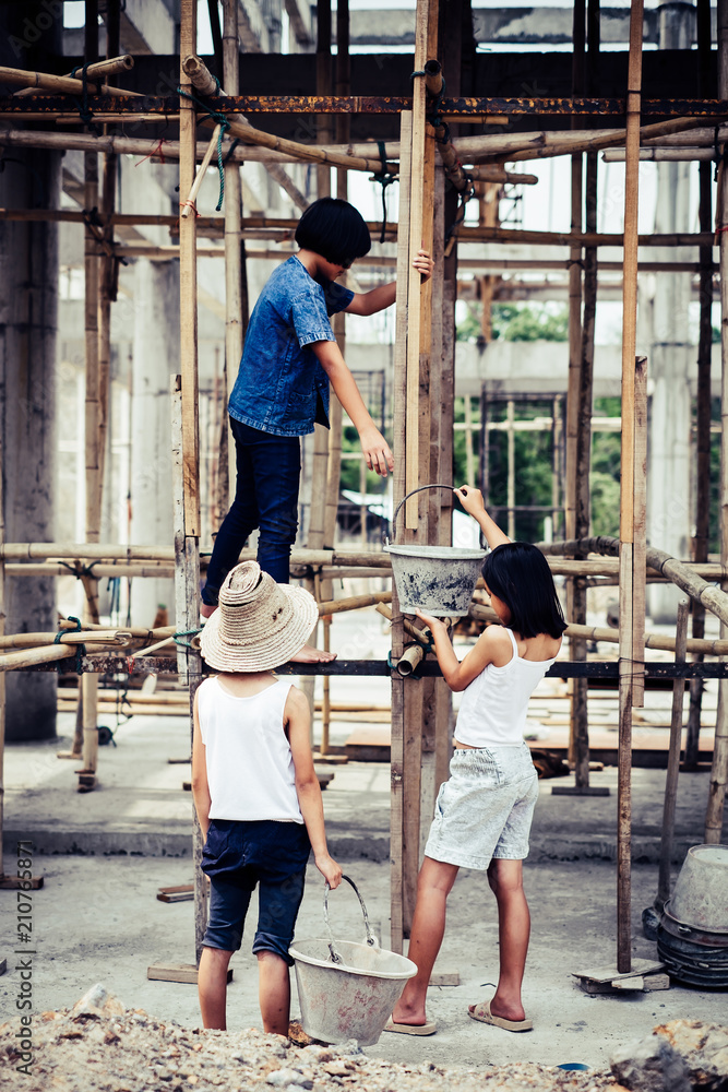 Little girl labor working in commercial building structure, World Day ...