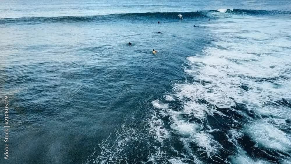 surf spot with men surfers and waves from ocean power. vacation scenic ...