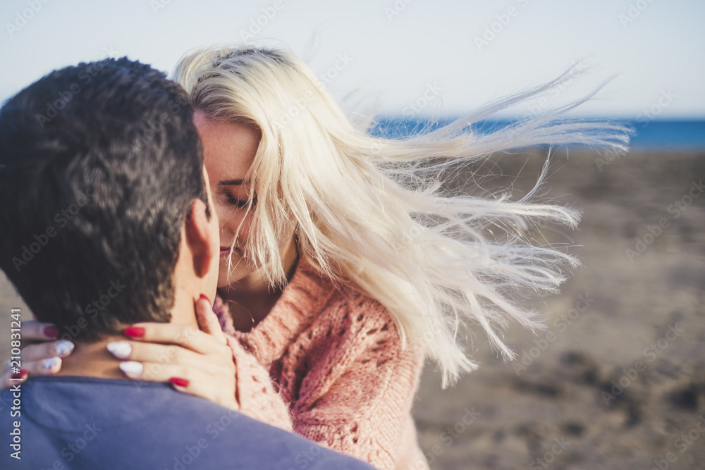 romantic couple in love hugging and kissing with closed eyes and full ...