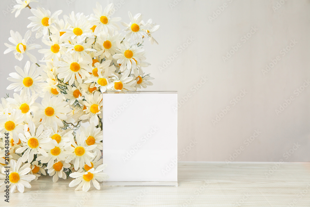 Mock up Menu banner standing on the table with Florist daisy flower ...