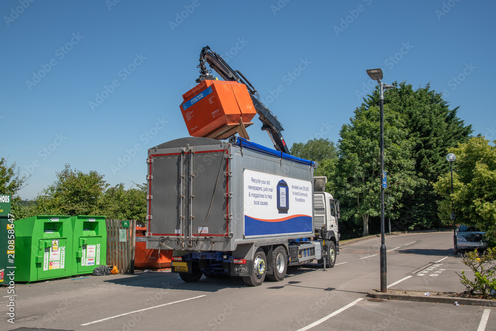 lorry emptying recycling bins in recycling area for bottles cans and ...