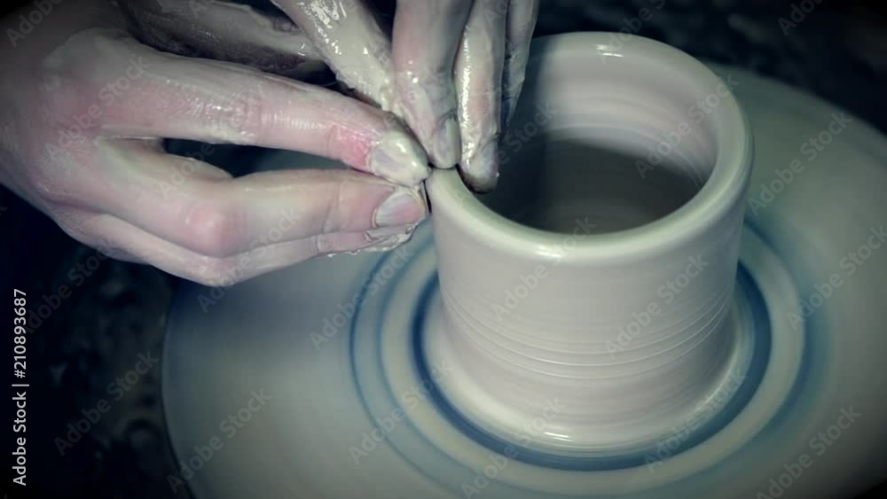 Sculptor sculpts pots products from white clay. Master keeps on empty ...