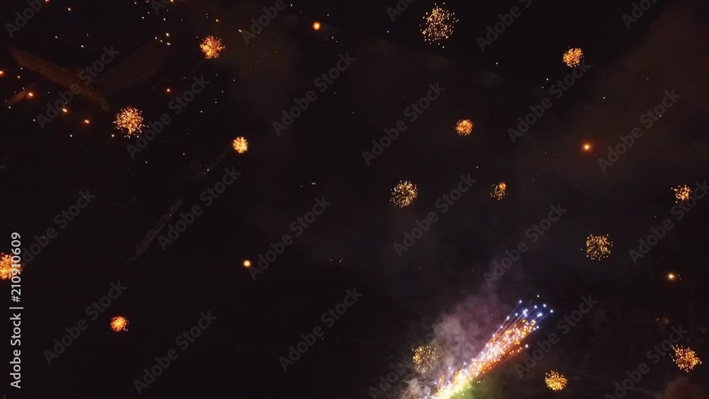 Bright firework explosion in the night sky. Fireworks salute with the ...
