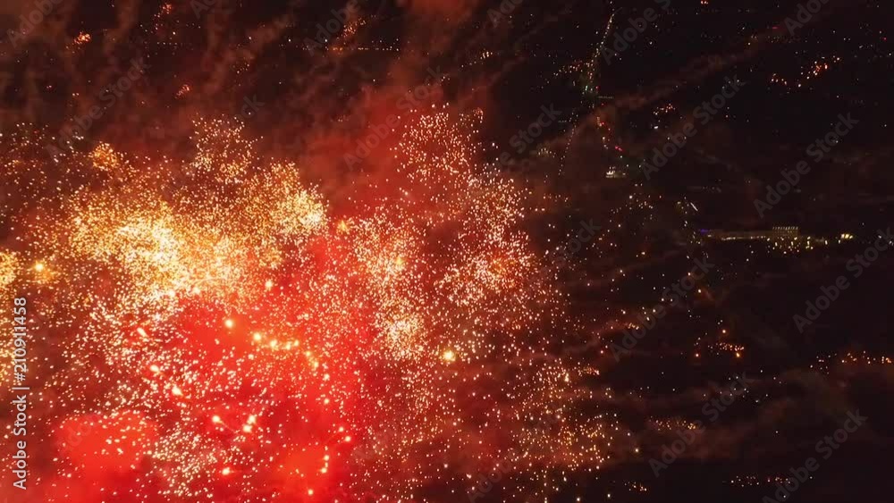 Bright firework explosion in the night sky. Fireworks salute with the ...