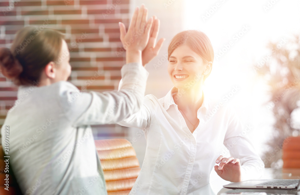 members of the business team giving each other a high five. Stock Photo ...