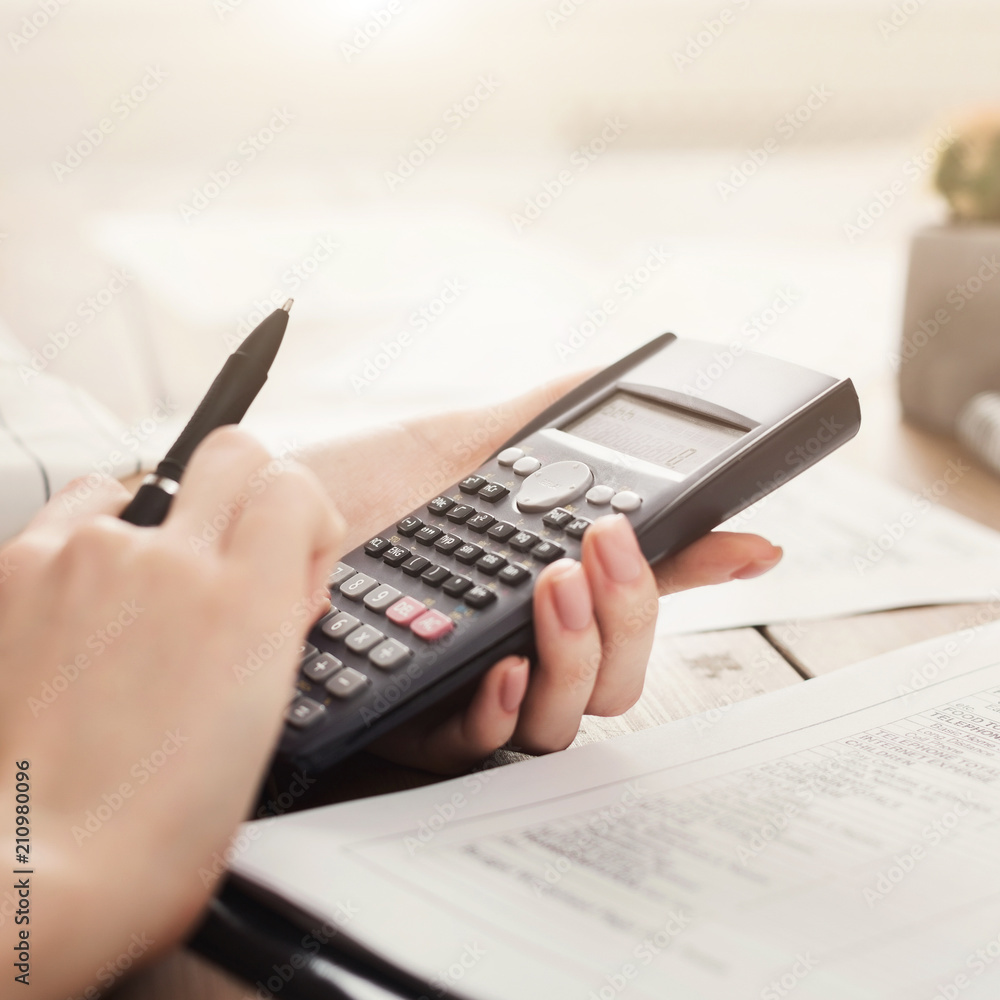 Poster Student girl calculating with calculator and writing notes ...
