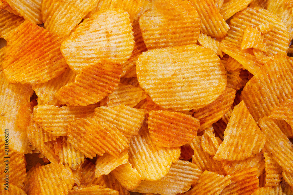 background corrugated golden chips with texture. Food texture. potato ...