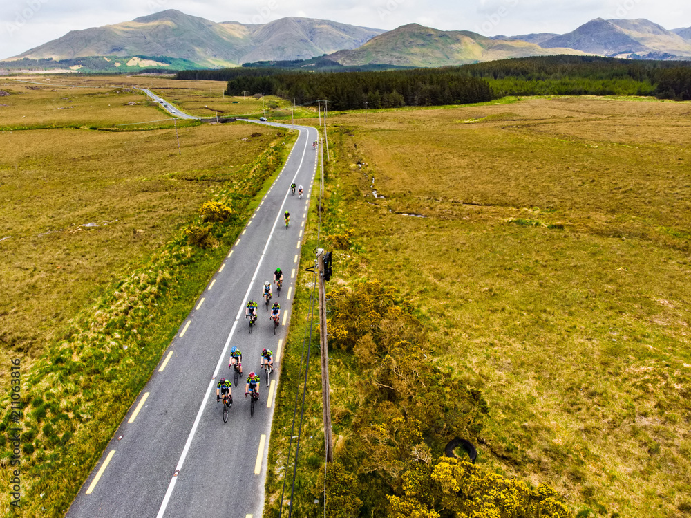 Professional cyclists competing in Connemara region in Ireland. Scenic ...
